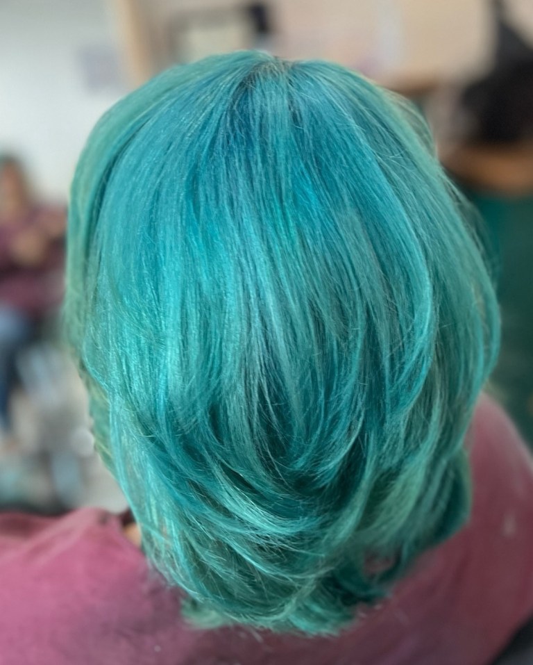 Turquoise punky color by Zee – Aveda Theory Hair Salon